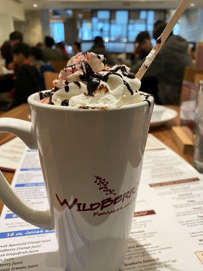 Hot chocolate that's dressed for the occasion, topped with a cloud of whipped cream and chocolate drizzle. Your childhood favorite, all grown up.