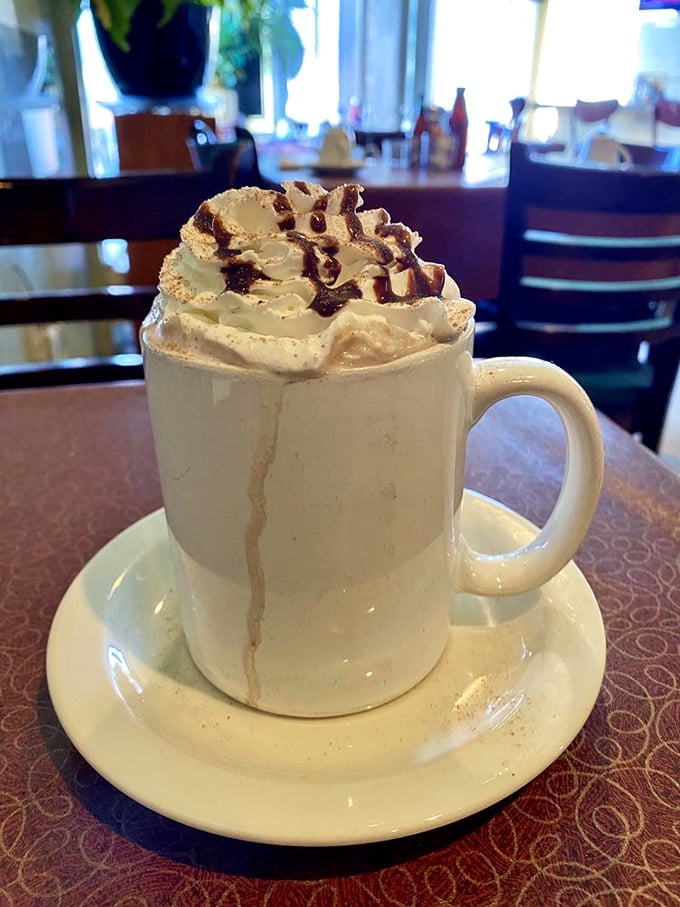 Hot chocolate that makes Swiss miss the point – topped with whipped cream mountains that deserve their own topographical map.