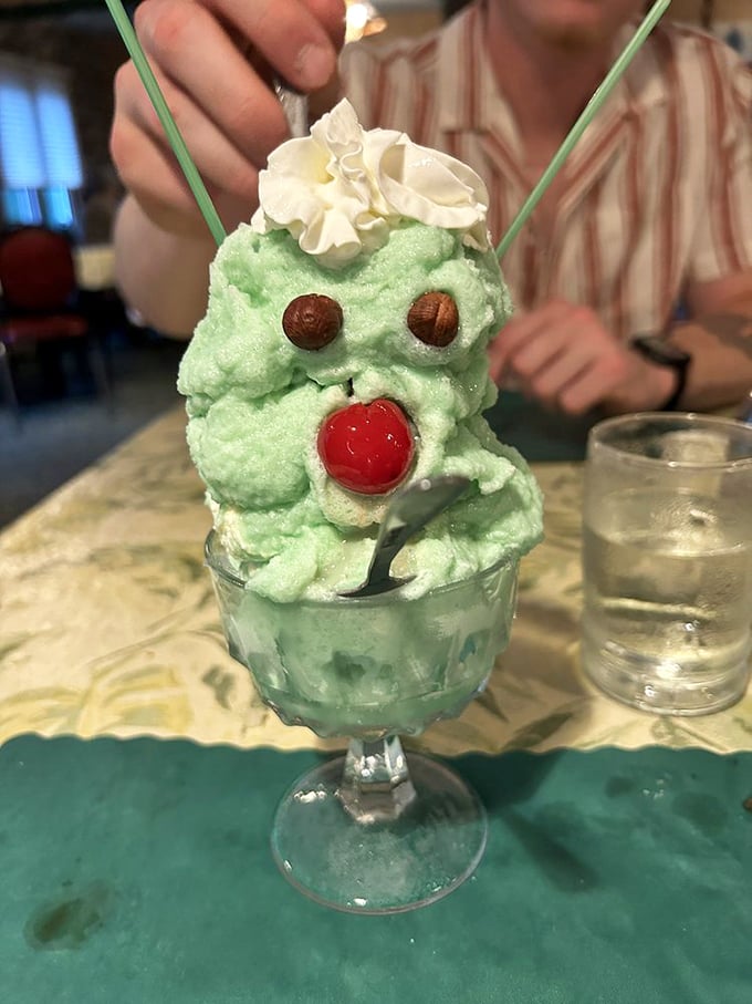 The grasshopper ice cream drink, complete with whimsical face—proof that dessert can be both delicious and slightly ridiculous. Mint, chocolate, and childhood nostalgia in one glass.
