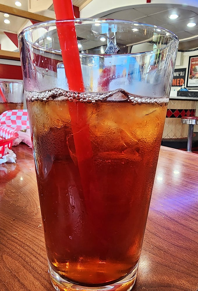 That iced tea with its classic red straw isn't just a beverage—it's sweet relief from the Arizona heat and the perfect companion to diner delights.