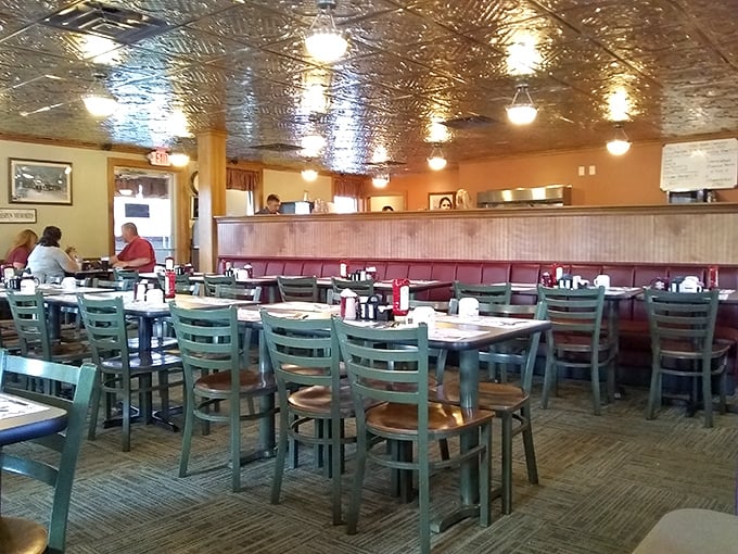 The dining room hums with conversation under that distinctive pressed-tin ceiling – a community gathering place where food and fellowship intertwine.