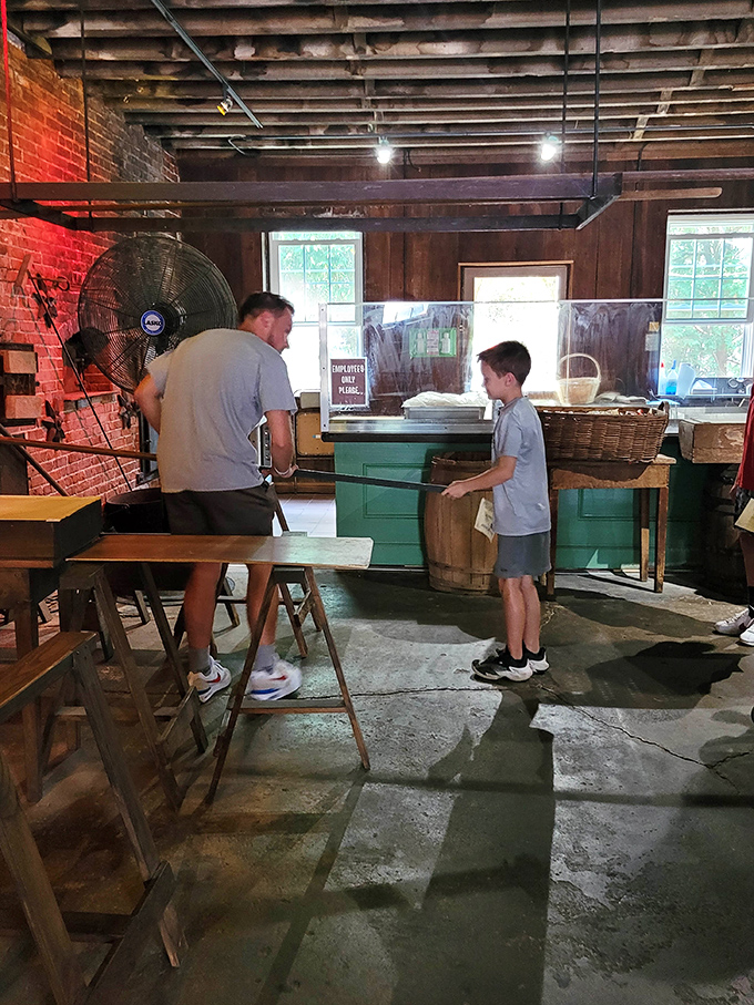 A father-son pretzel pilgrimage in progress—creating memories one twist at a time in a space where time seems to slow down for the sake of good food.