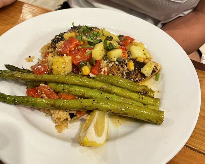 This blackened fish with tropical salsa isn't just dinner – it's Florida sunshine on a plate. The asparagus provides the perfect counterpoint to all that flavor.