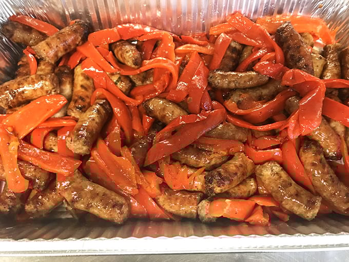 Italian sausage swimming in a sea of sweet peppers—a simple combination that proves sometimes the most straightforward dishes deliver the most profound satisfaction.