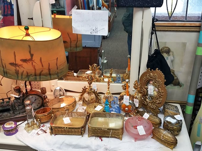 A tableau of golden treasures that would make King Midas jealous—that vintage lamp casting the kind of glow Instagram filters try to replicate.