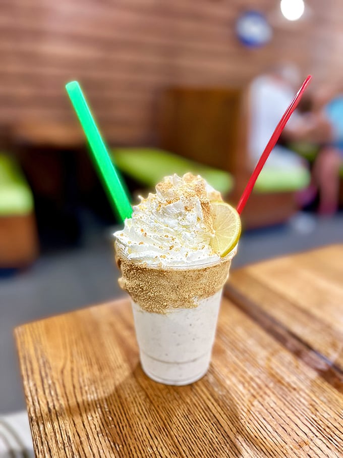 This key lime shake isn't just a drink—it's Florida's greatest hits album in a glass. The whipped cream crown and lime garnish are just showing off.