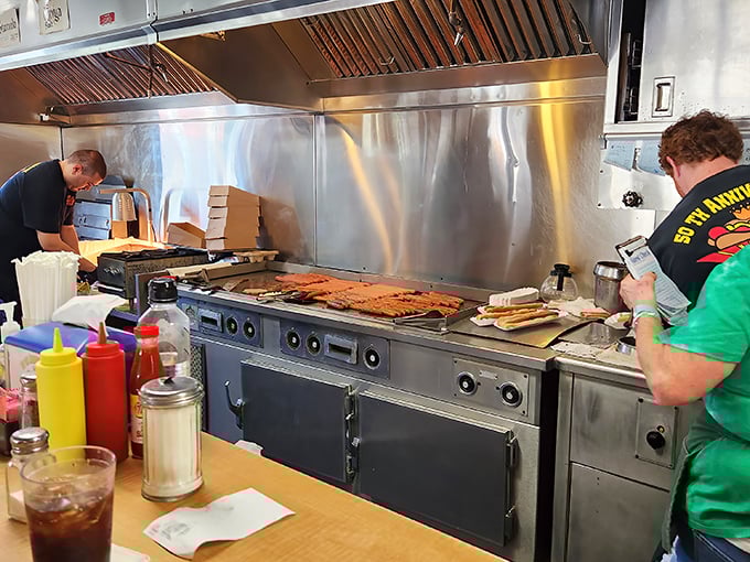 Where the magic happens – that flat-top grill has probably seen more action than a Hollywood stuntman. Seasoned to perfection.