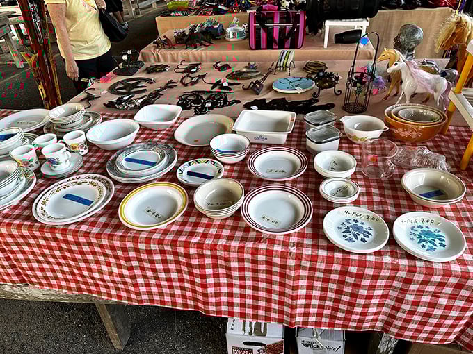 Vintage dishware arranged on classic red-checkered tablecloths—grandma's kitchen reincarnated and priced to sell.