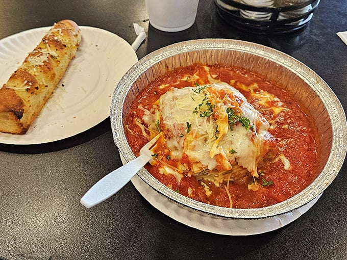 Lasagna that doesn't know the meaning of restraint. That cheese pull isn't just photogenic—it's the siren song of comfort food done absolutely right.