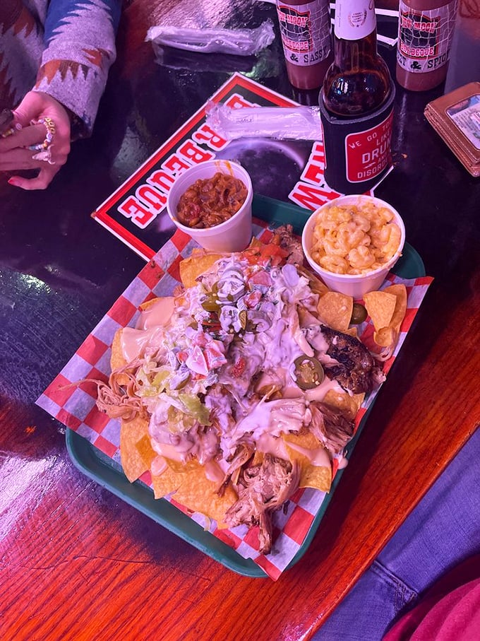 Loaded nachos that laugh in the face of moderation, topped with enough pulled pork to make you reconsider sharing.