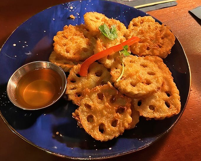 Lotus root chips that transform a humble vegetable into addictive crispy discs – the kind of snack that disappears before conversation even begins.