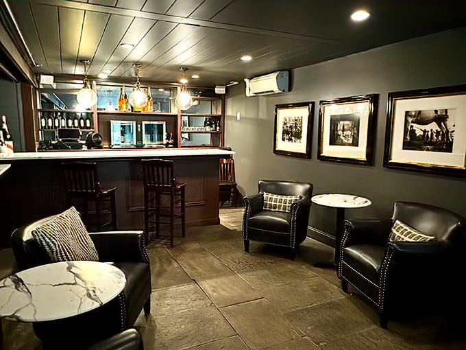 The lounge area whispers "stay for one more drink" with leather chairs practically begging you to sink in and linger.