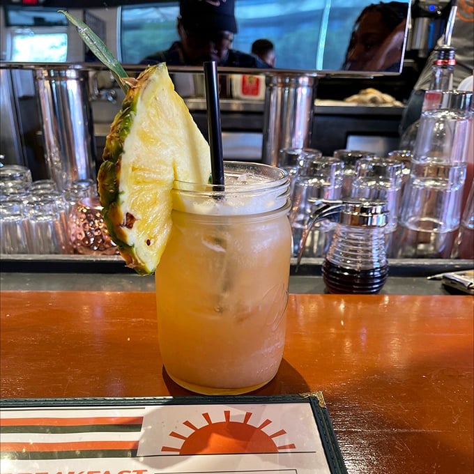 This tropical cocktail, garnished with fresh pineapple, isn't just a drink—it's a vacation in a mason jar.
