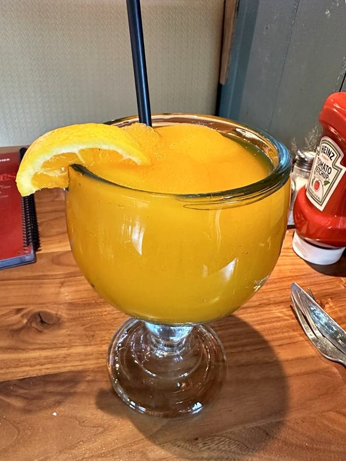 This mango cocktail isn't just a drink—it's liquid sunshine with a rum passport, vacation in a glass.
