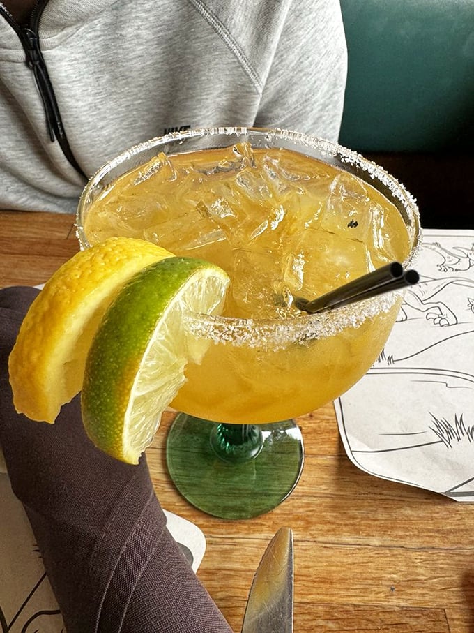 A margarita with the perfect salt-to-sweet ratio, garnished with citrus. Vacation in a glass, no passport required.