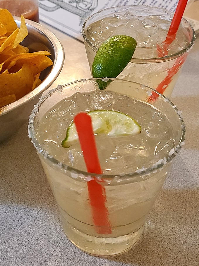 Margaritas with salt-rimmed glasses and fresh lime—because sometimes adult beverages deserve as much attention to detail as the main course.