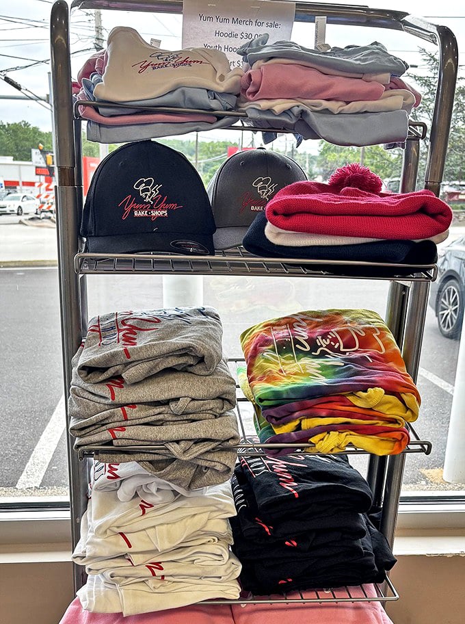 Even the merchandise display screams devotion – because nothing says "I'm serious about donuts" like wearing the logo on your head.