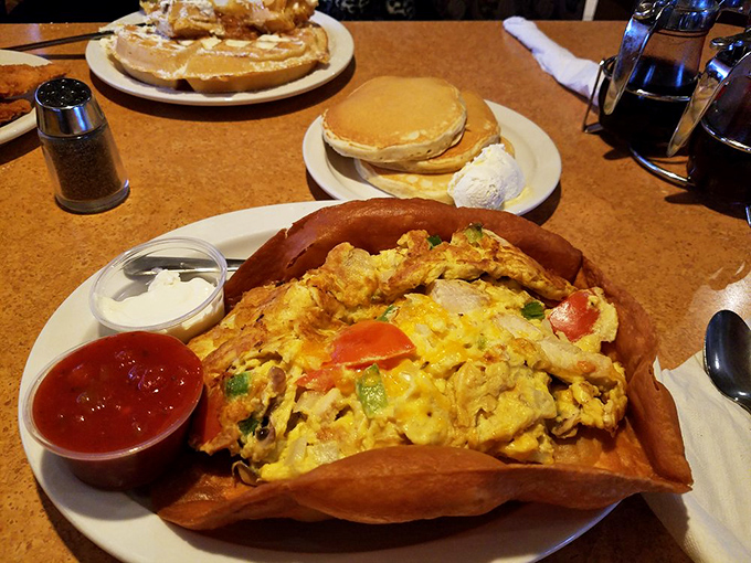 This isn't just an omelet – it's a tortilla bowl fiesta where eggs, cheese, and vegetables have gathered to throw the best party your taste buds will attend all day.