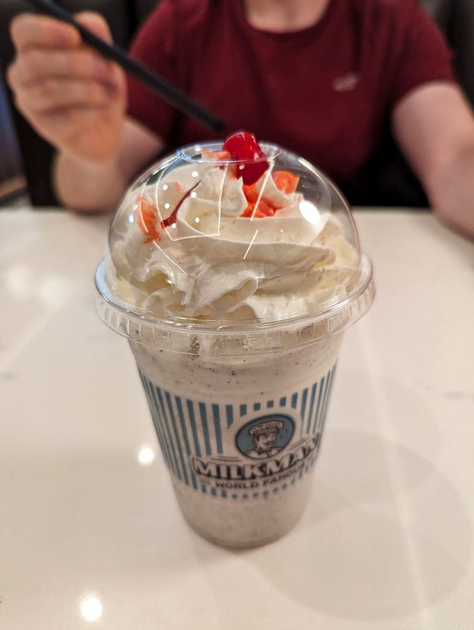 That milkshake's thick enough to support a spoon standing straight up – physics never tasted so good.
