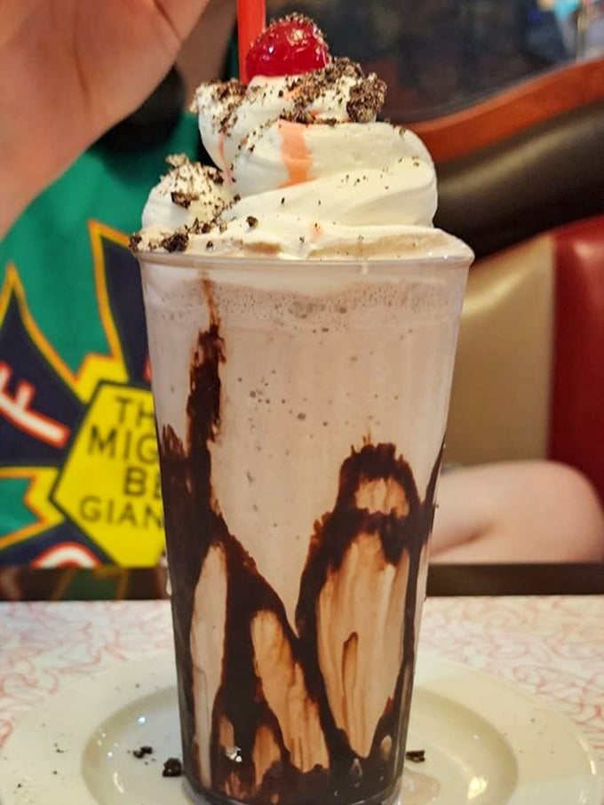 Not just a milkshake but a tower of indulgence—chocolate cascading down the sides like delicious modern art you can actually eat.