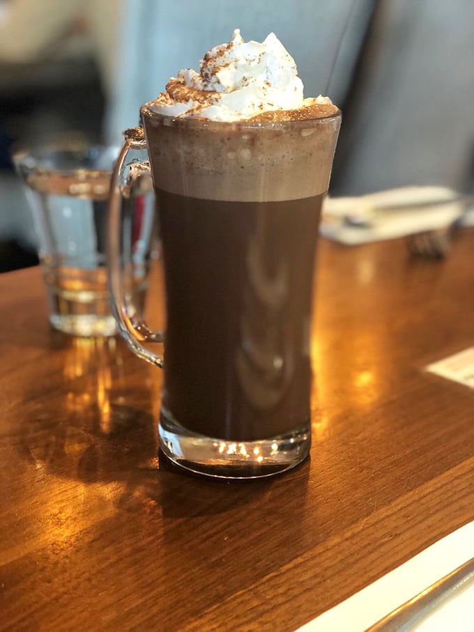 A mocha topped with whipped cream so perfect it belongs in the Louvre, not just on your breakfast table.