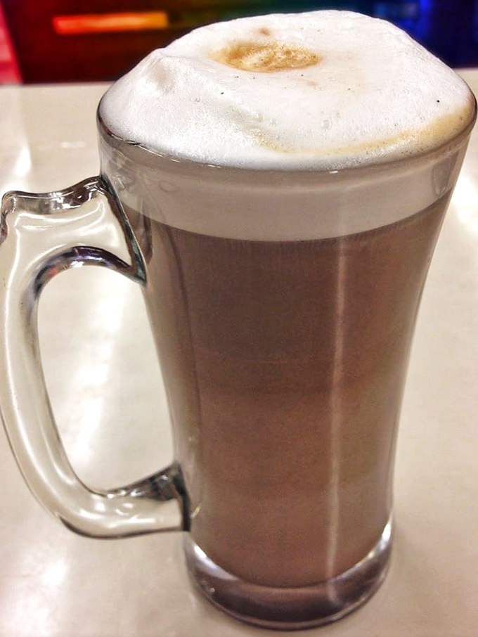 A mocha that doesn't need fancy latte art to impress – just honest coffee comfort topped with a cloud of whipped cream.