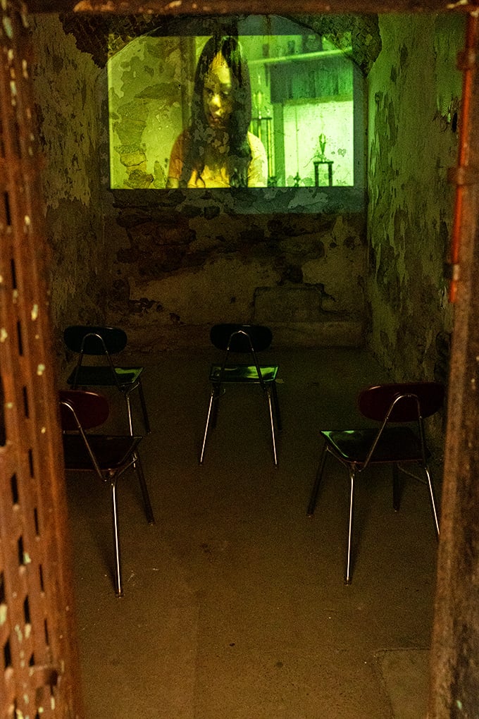 Movie night in prison takes on a whole new meaning in this eerie makeshift theater. The green glow adds an extra layer of creepiness.