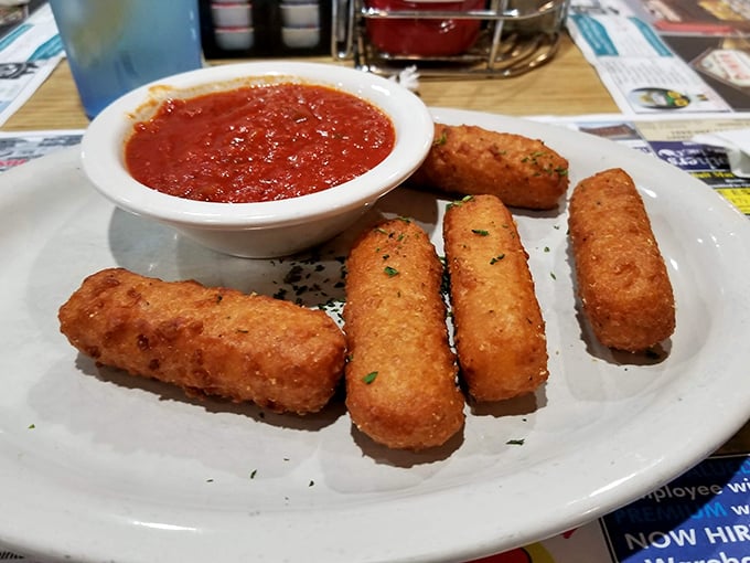 Mozzarella sticks—golden-brown on the outside, molten cheese within—served with marinara for dipping. The universal language of appetizer happiness.