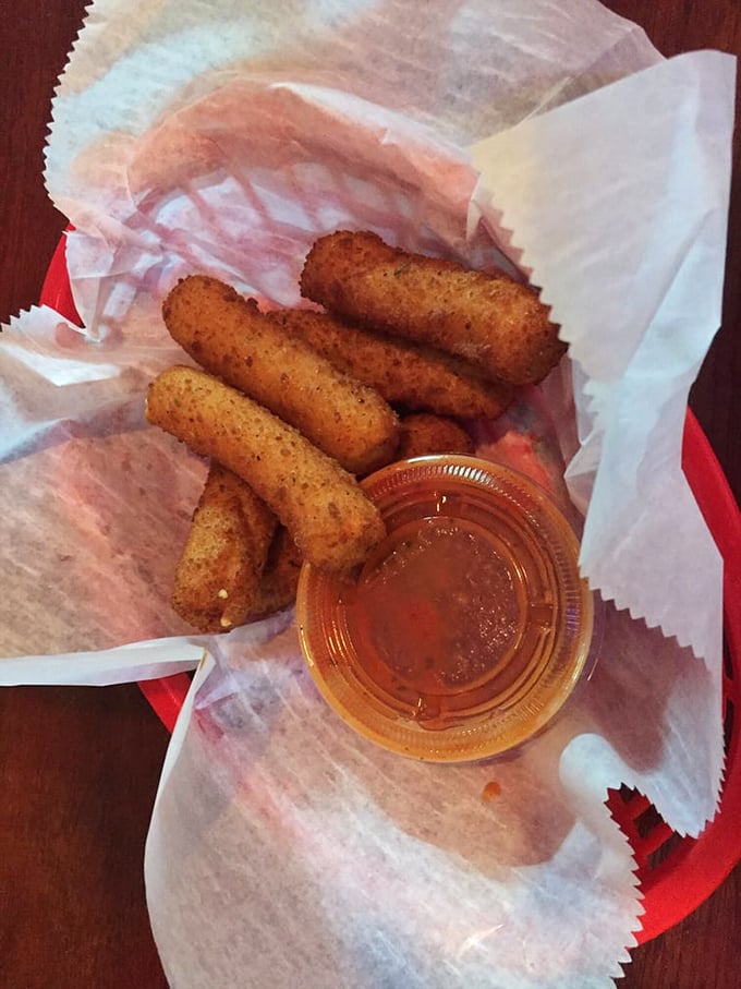 Mozzarella sticks – the comfort food equivalent of a warm hug. Crispy outside, gooey inside, with marinara for dipping. Some classics never need updating. 