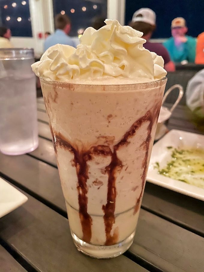 This isn't just a mudslide—it's dessert and cocktail having a beautiful romance in a glass, topped with a cloud of whipped cream.