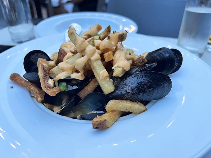 Mussels and frites: where the ocean meets the potato patch in a dish that demands you use empty shells as impromptu tongs.