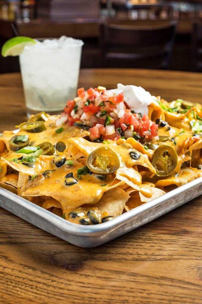 These aren't just nachos—they're an architectural marvel of chips, cheese, jalapeños and fresh pico de gallo that demands to be shared (but you won't want to).