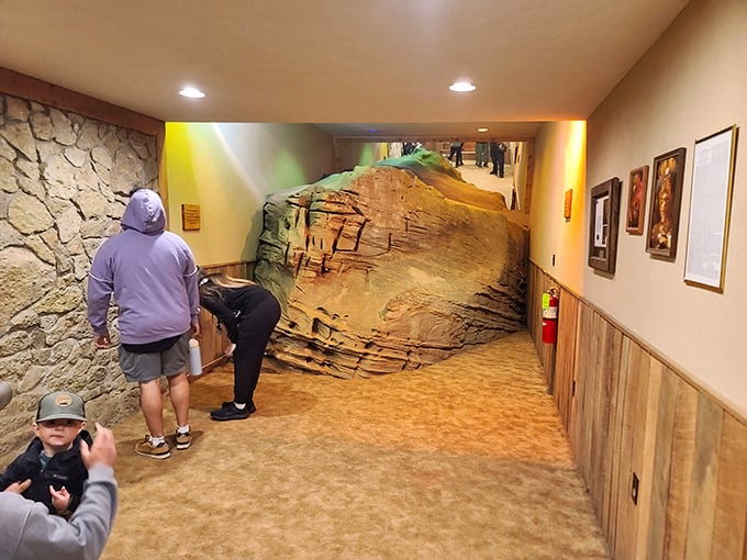 The entrance corridor sets the mood perfectly—part museum, part geological teaser. That rock formation is saying, "You ain't seen nothing yet, folks!"