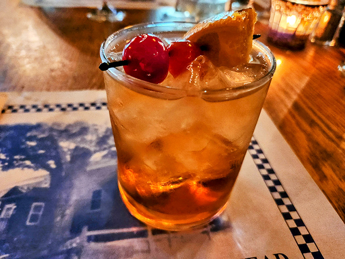 An Old Fashioned that Don Draper would approve of, garnished with a cherry that's seen more sugar than most Halloween hauls.