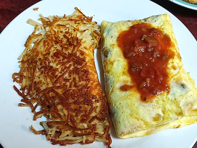 An omelet that's seen the inside of a skilled pan and hash browns crisped to perfection – breakfast harmony achieved.