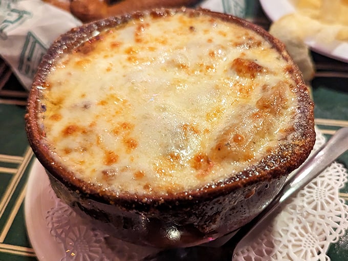 French onion soup that's achieved the perfect cheese-pull potential – a bubbling cauldron of comfort that's worth the inevitable chin dribble.