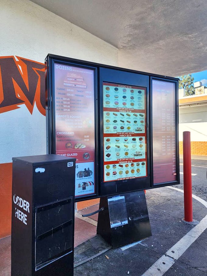 The outdoor ordering area—where strangers become temporary friends united by a common mission: securing the perfect donut.