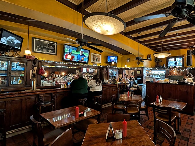 Yellow walls and dark wood create that perfect neighborhood vibe—casual enough for Tuesday lunch, special enough for celebrating life's victories, big or small.