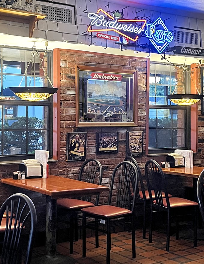 Rays memorabilia and Budweiser signs create the perfect backdrop for burger bliss. This isn't décor—it's a timeline of Tampa Bay sports history.