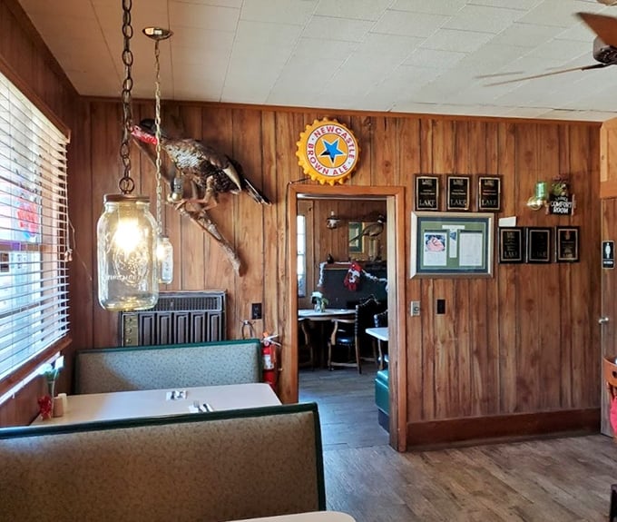 Mason jar lighting fixtures and wood-paneled booths create that "Grandma's cabin meets gourmet hideaway" ambiance that keeps locals coming back.