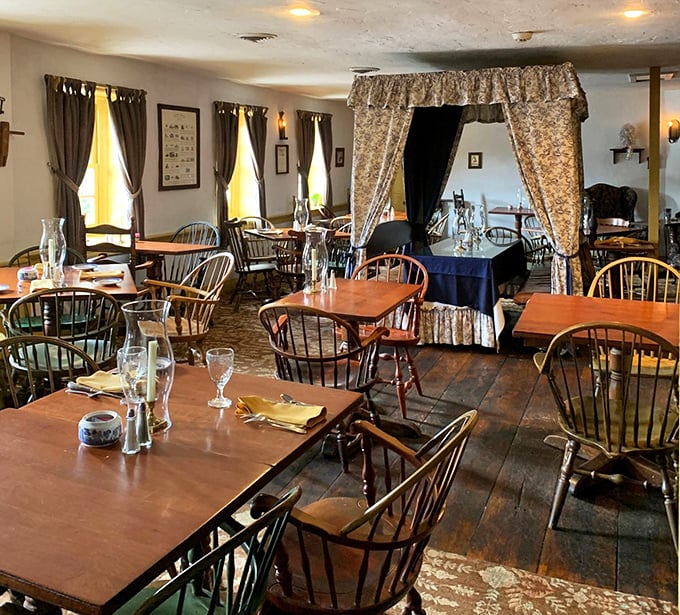 Windsor chairs and period details transport diners to another era, while the canopied dining area adds a touch of colonial elegance to every meal.