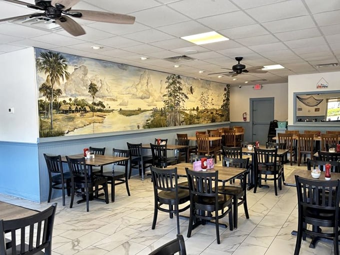 A sprawling Florida landscape mural watches over diners, a visual reminder that you're eating seafood in its natural habitat—minus the sand in your shoes.