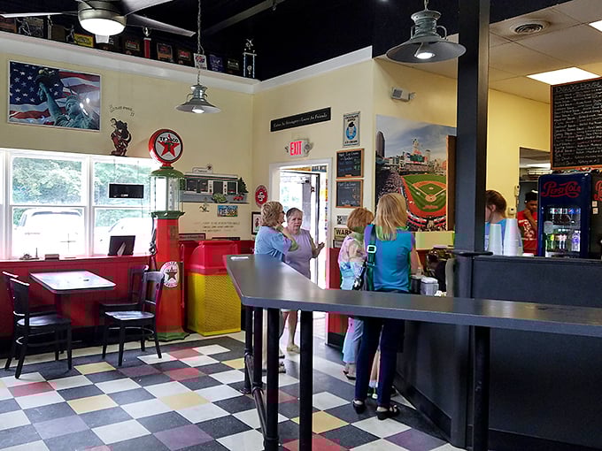 The checkered floor and vintage décor aren't just design choices—they're time machines to when eating was simple pleasure.