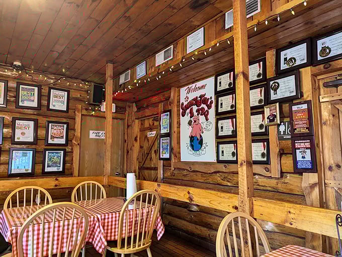 Awards line the walls like trophies in a champion's case – silent testimonials to decades of barbecue excellence in this wood-paneled sanctuary.