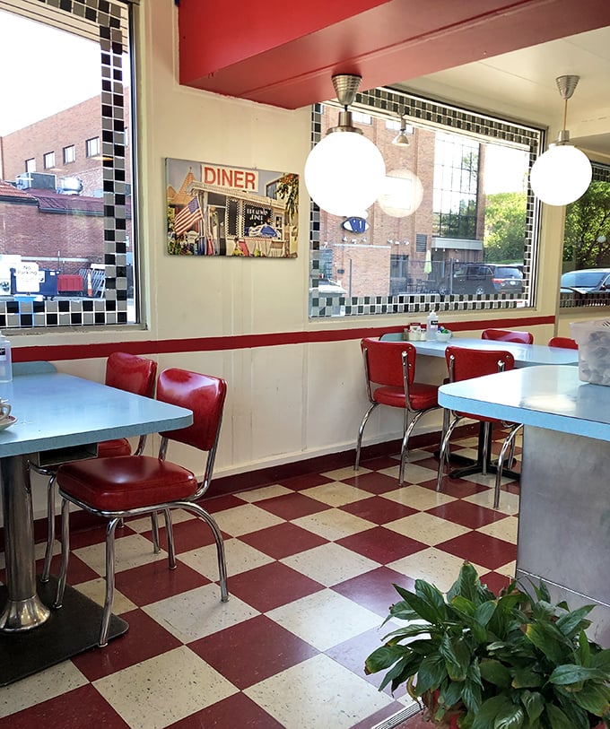 The quiet elegance of diner seating – where every table offers a front-row view to downtown Columbia and passing conversations.