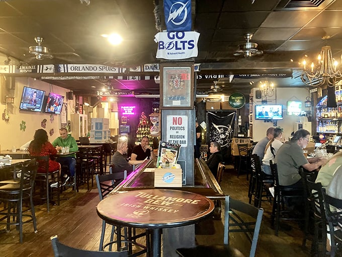 Sports on the screens, Tampa Bay team flags overhead, and a sign declaring "No Politics or Religion"—the perfect recipe for pub harmony.