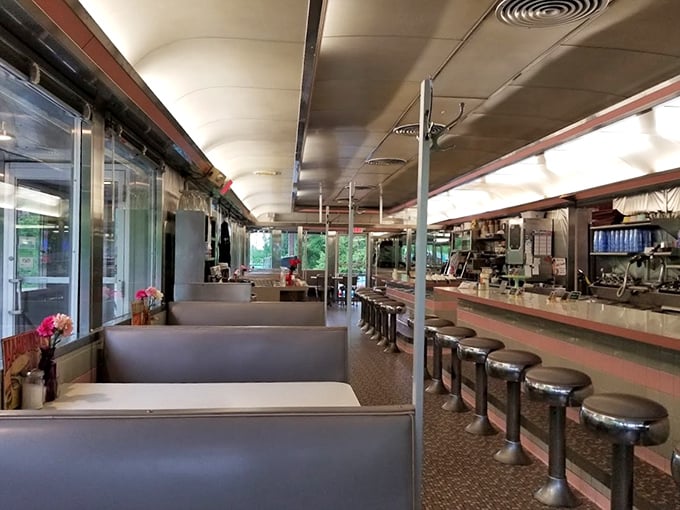 The classic diner layout—where booths offer privacy for intimate conversations and counter seats invite solo diners to become part of the community.