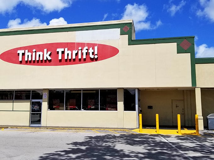 The distinctive red oval logo beckons from the roadside. In the Florida sunshine, Think Thrift's facade glows with the promise of undiscovered treasures. 