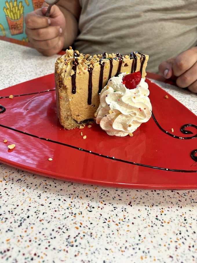 
This isn't just peanut butter pie—it's peanut butter poetry. The chocolate drizzle creates the kind of abstract art that belongs in both museums and stomachs. 