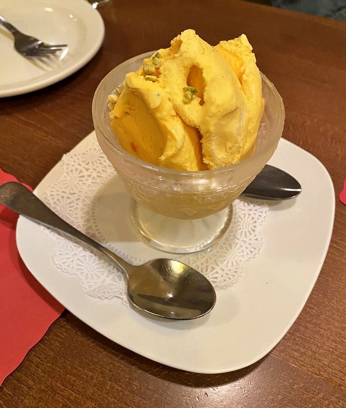Saffron ice cream that tastes like sunshine and luxury. Those pistachios aren't just garnish—they're exclamation points at the end of a perfect meal.